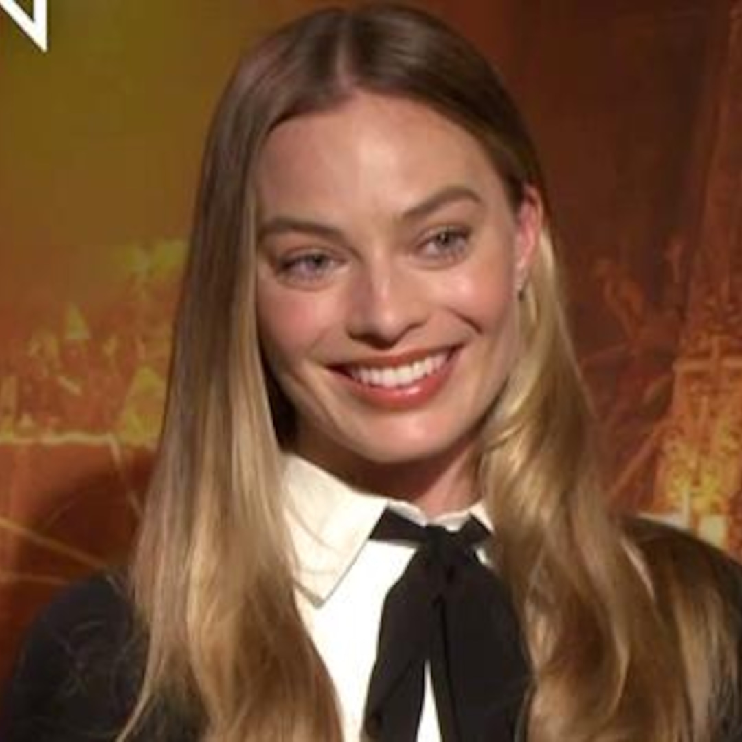 Margot Robbie Reacts To Kissing Brad Pitt Exclusive